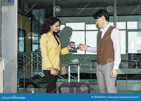 Caucasian Passenger Is Showing Her Online Check In Qr Code Boarding Pass To The Airline Ground