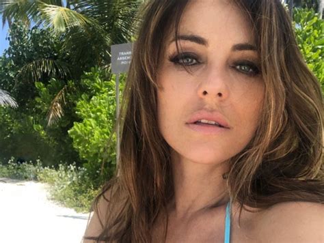 Watch Elizabeth Hurley Show Off Cleavage While Posing In A Tiny Bikini Top Page 5 Of 6