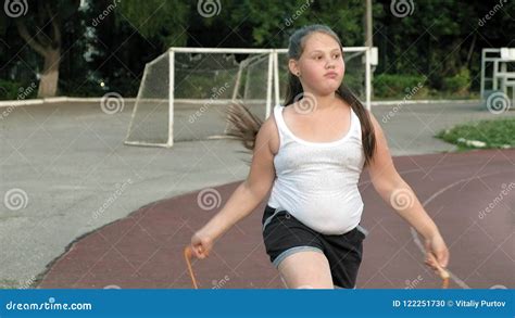 Little Fat Girl Jumping Rope In The Stadium Stock Footage Video Of
