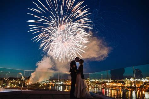 Bride And Groom Kissing Under Fireworks