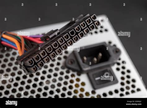 Large Plug To Power The PC Motherboard Components Of The Computer Power Supply Dark Background