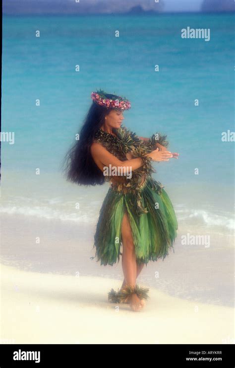 Woman Dances Hula At Kailua Beach In Ti Leaf Skirt And Leis Oahu Stock