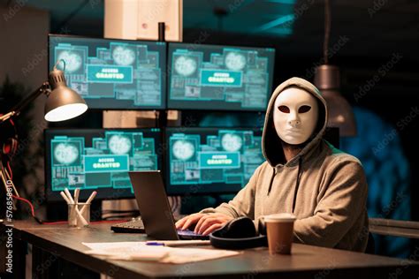Hacker Wearing Mask And Hood To Hack Computer System Breaking Into Company Servers To Steal Big