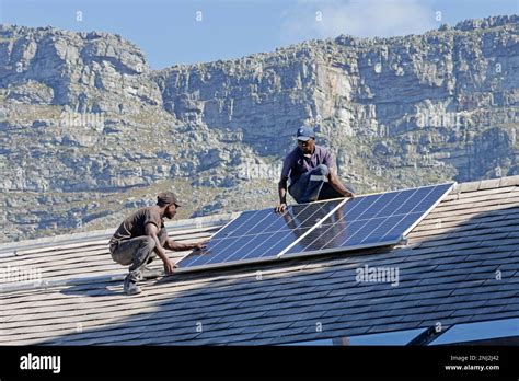 Team Installing Hybrid Grid Tied Electrical Installation Of Solar