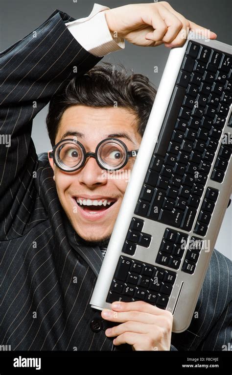 Computer Geek With Computer Keyboard Stock Photo Alamy
