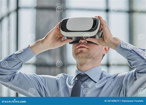 Businessman In Virtual Reality Headset In The Office Stock Image