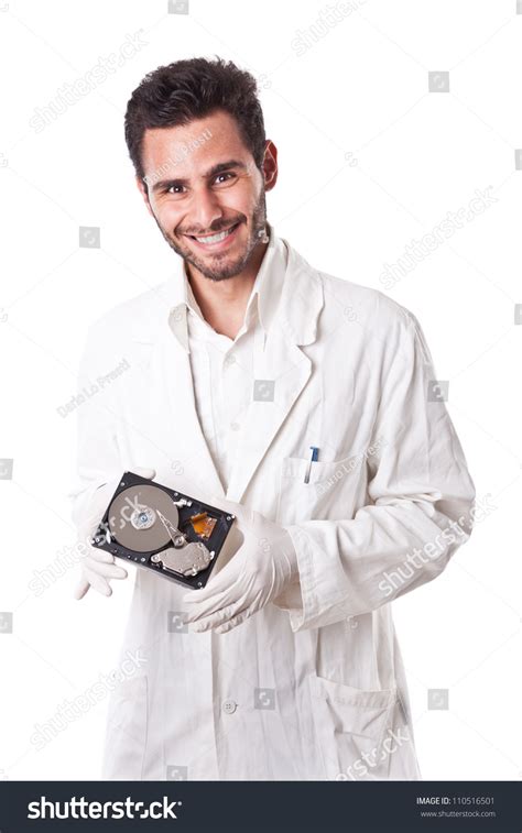 A Technician Wearing Lab Coat Holding An Hard Disk Drive Over 10