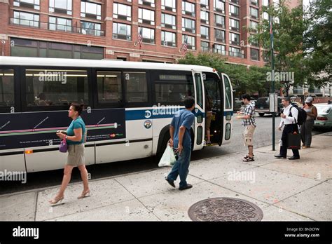 Ny Transit Authority City Bus Loading And Discharging Diverse Passengers