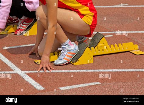 athletes debugging run up ware on plastic runway in a middle school