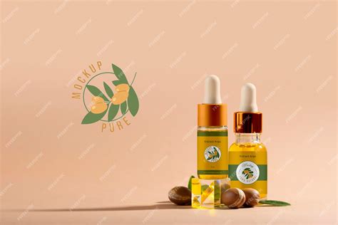 커널과 스포이드가 있는 아르간 오일 화장품 병 모형 프리미엄 Psd 파일