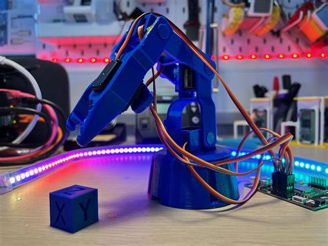 i made a simple robot arm that can be controlled by any browser over wifi using a raspberry pi