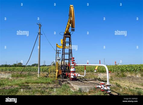 The Pumping Unit As The Oil Pump Installed On A Well Equipment Of Oil Fields Stock Photo Alamy
