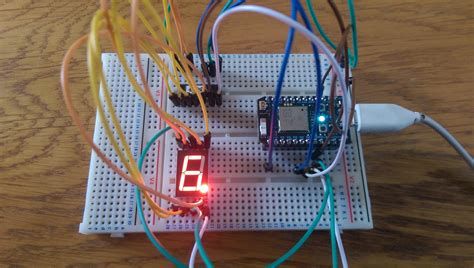 code frieze particle photon driving a 7 segment display
