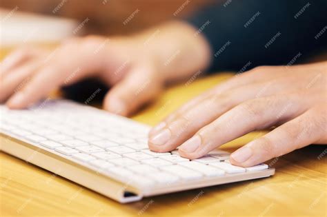 Premium Photo Side View Of Man Hands Typing On White Computer