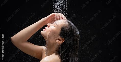 Asian Woman She Takes A Shower And Washes Her Hair In The Black