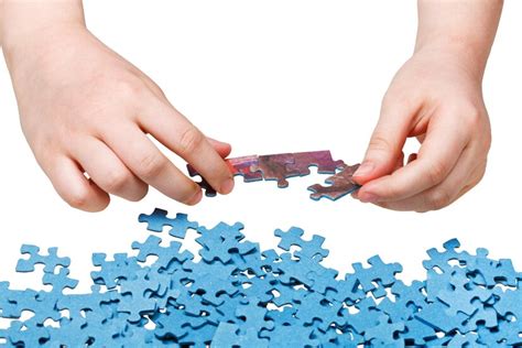 Premium Photo Assembling Of Jigsaw Puzzles Isolated