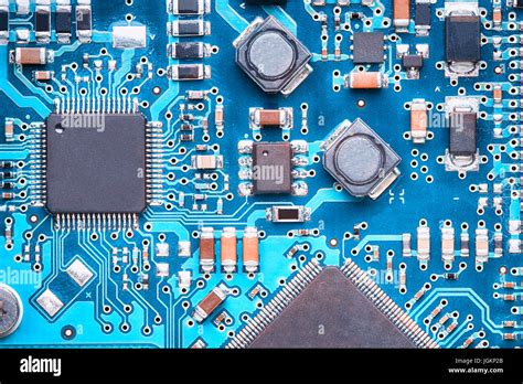 Macro Top View Of A Printed Circuit Board With Processors Capacitors And Transistors Stock