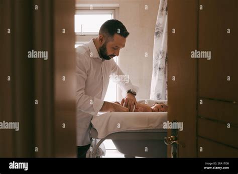 Dad Changing Baby Diaper In The Bathroom Stock Photo Alamy