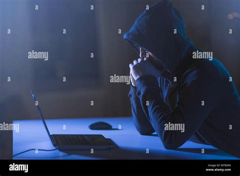 Hacker With Laptop Computer In Dark Room Stock Photo Alamy