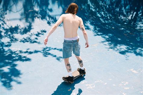 Free Photo Shirtless Skater On Board