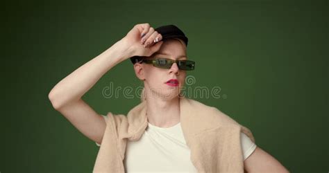 Fashinable Non Binary Man Posing On Camera On Color Background Stock