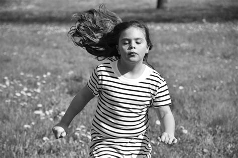 Premium Photo Portrait Of Girl Running In Field