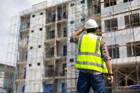 Premium Photo Back View Engineering People Construction Site Construction Worker Planning And