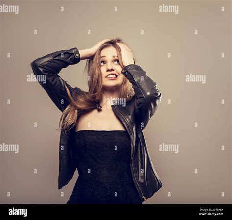 Confusion Thinking With Fair Blond Hair Woman Looking Up With Doubt