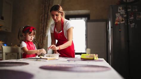 Mom Teaches Daughter To Cook Stock Video Footage K And Hd Video Clips Shutterstock
