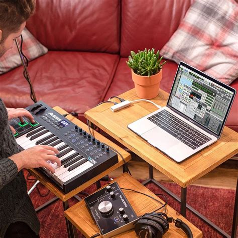 Alesis VI25 25 Key USB MIDI Semi Weighted Keyboard Controller With 16 Pads 8 Assignable Knobs