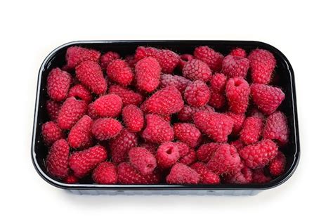 Premium Photo Raspberry In Black Container Isolated