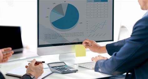 Premium Photo Two Business Teamwork Calculating A Business Valuation