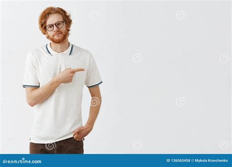 Indoor Shot Of Unsure Bothered Good Looking Ginger Guy With Beard In