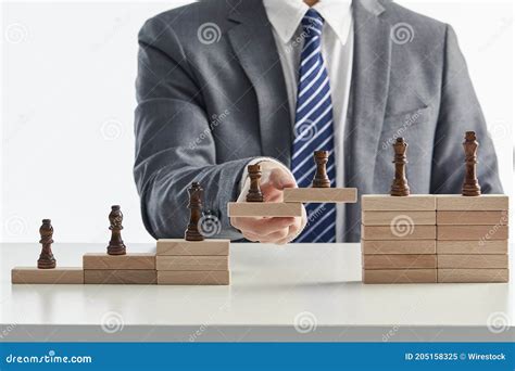 businessman in a suit bridging the gap between corporate hierarchy problem solving concept
