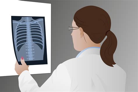 A Female Doctor Examines A Chest X Ray Of A Patient In The X Ray