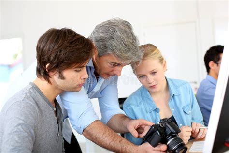 Teacher In Photography Class Showing Camera Stock Image Image Of