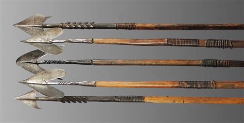 Four Different Types Of Arrows Are Lined Up In A Row On A Gray Background With One Arrow