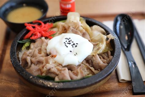 Delectable Gyudon Japanese Beef Served On A Bed Of Rice And Crowned