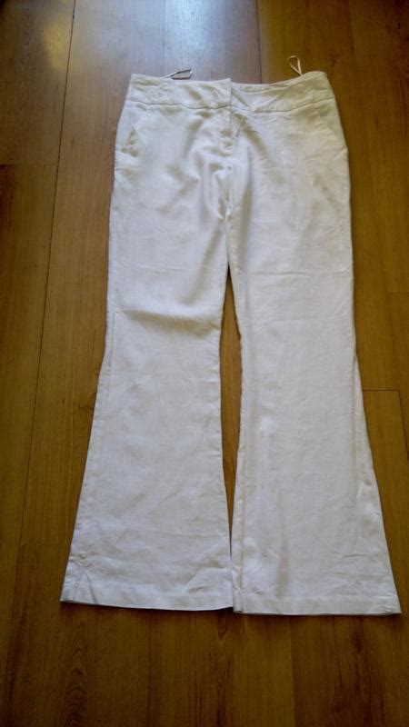 Довгі білі штани до низу кльош — ціна 136 грн у каталозі Брюки Купити жіночі речі за доступною