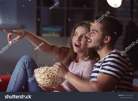 Man And Woman On Sofa Watching Tv Dark Room Over 453 Royalty Free