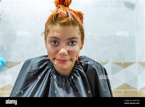 A Teenage Girl Dyes Her Hair Red The Process Of Dyeing Hair Red Self Coloring Of Hair At Home