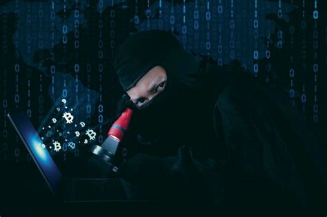 premium photo hacker with flashlight trying to hack in to a customer
