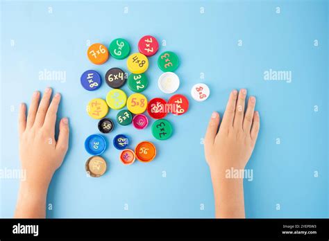 Play Fun Multiplication Games Bottle Caps With Multiplication Exercises On Blue Background
