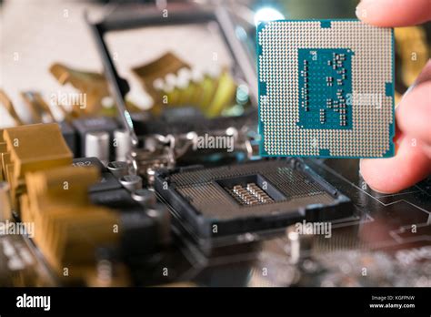 Technician Plug In CPU Microprocessor To Motherboard Socket Stock Photo Alamy