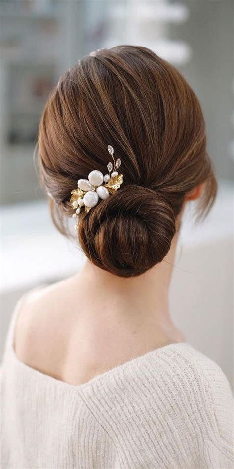 53 Best Wedding Hairstyles For 2023 Brides Simple Twisted Low Bun