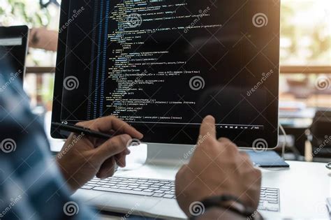 Two Data Scientists Work Together At Their Office Analyzing Big Data On