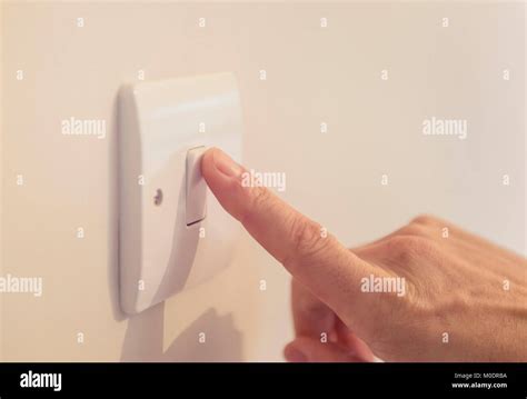 Switching A Light Switch Stock Photo Alamy