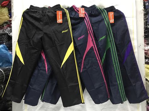 181กางเกงผ้าร่มแต่งแถบใช้ได้ทั้งหญิงและชาย มีซับในเป็นตาข่ายขาว 6658ลิน Thaipick