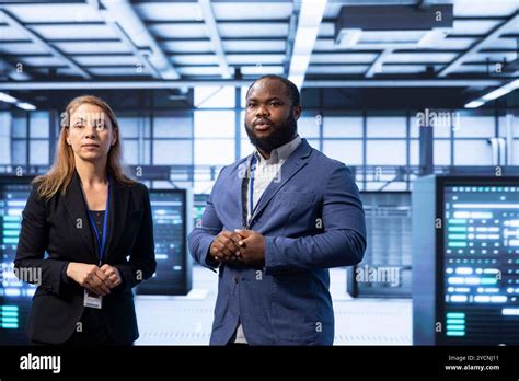 teamworking supervisors overseeing data center after configuring
