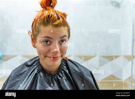A Teenage Girl Dyes Her Hair Red The Process Of Dyeing Hair Red Self Coloring Of Hair At Home